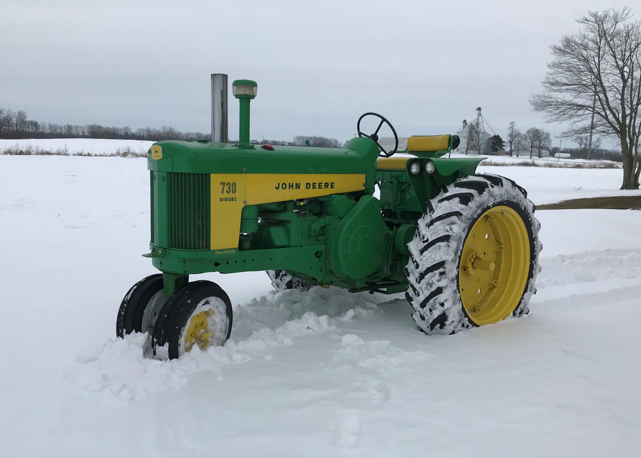 JD 730 out in the snow - Green Magazine